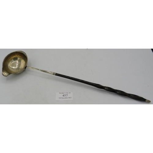 A Georgian unmarked toddy ladle with embossed handle. Condition report ...