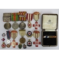 A large collection of Red Cross and Voluntary Medical Service medals ...