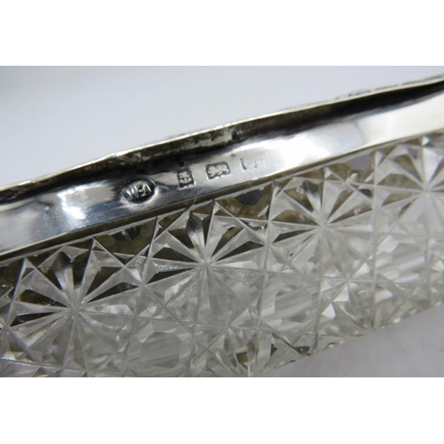 A cut glass long rectangular pin box with silver lid, floral embossed ...
