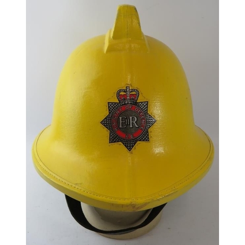 A 1980s British MOD Fire Service yellow fire helmet