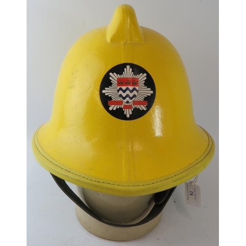 A 1980s British London Fire Brigade yellow fire helmet