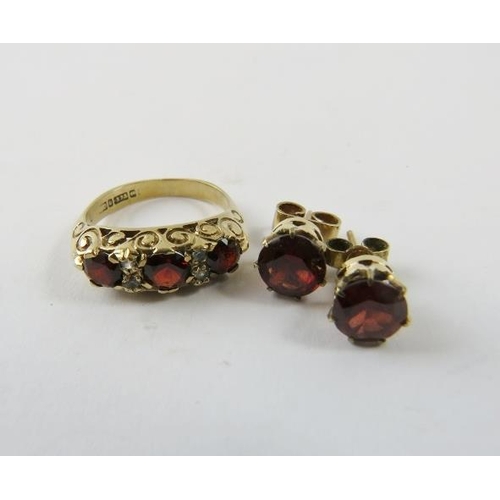 A Victorian 9ct yellow gold and garnet three stone carved half hoop ...