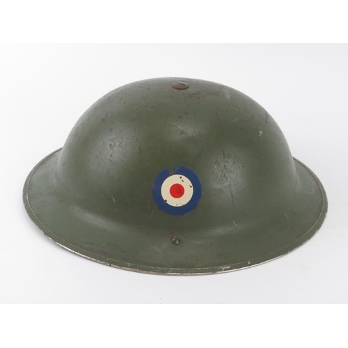 A WWII British RAF Brodie helmet. Painted Royal Air Force Roundel to ...