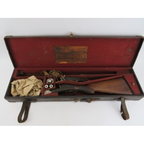 An antique James Purdey & Sons gun / rifle leather case with various ...