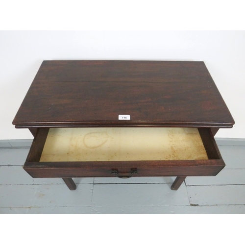 A George III mahogany fold over top tea table, fitted frieze drawer ...