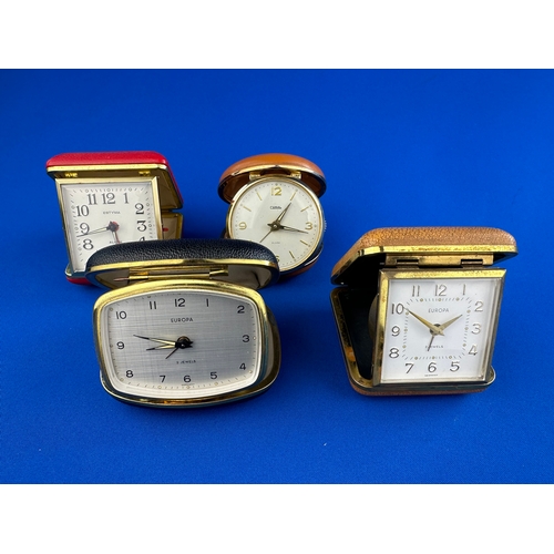 Four Vintage Travel Alarm Clocks