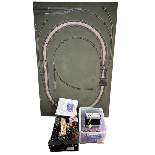 Mounted OO Gauge Track along with Various Wires and Model Railway ...