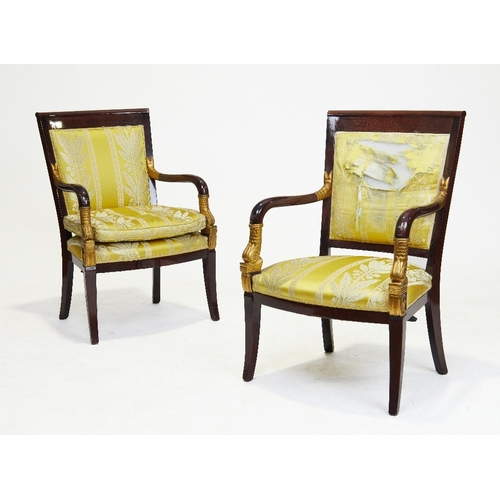 A pair of French lacquered oak chairs, of Empire style, with carved ...