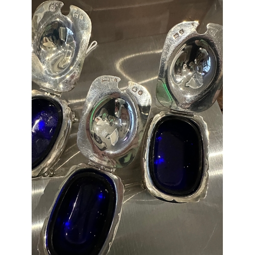 Three sterling silver mustard with liners, Chester (DSJ), London and W ...