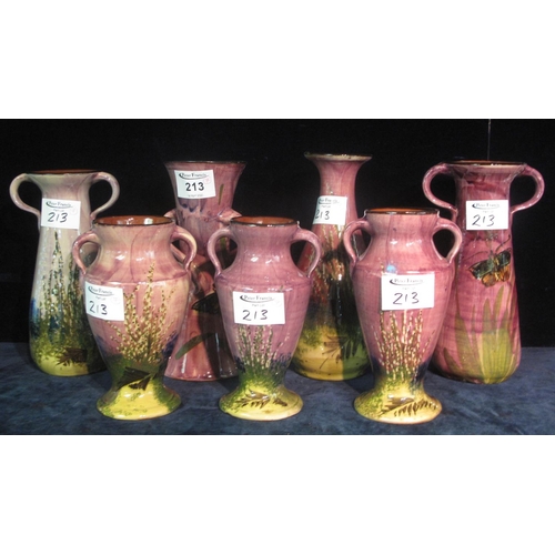 A collection of seven Torquay pottery Lemon and Crute two handled and ...