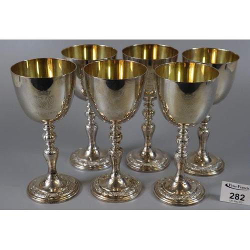 A set of six sterling silver goblets by Garrard to commemorate the ...