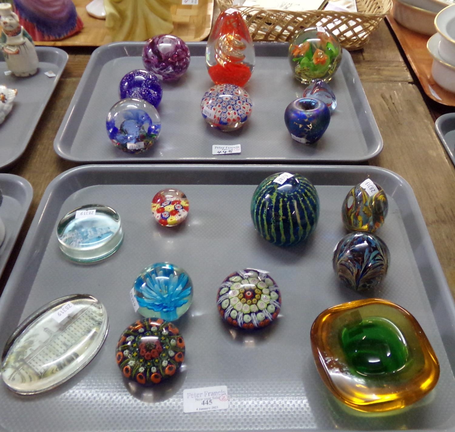 Two trays of glass paperweights, to include: millefiori, two Adrian ...