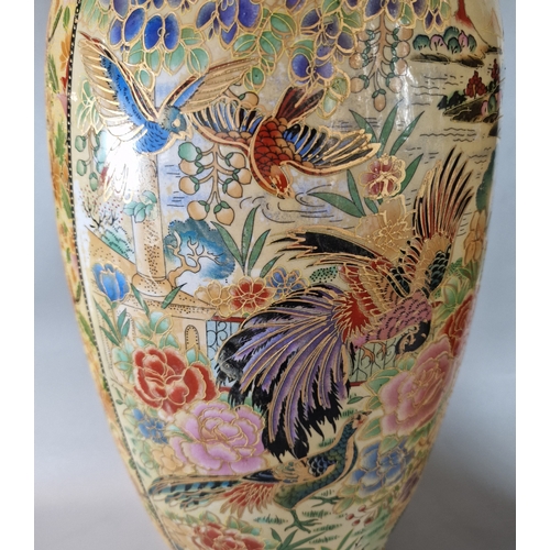 Pair of Oriental style ceramic two handled vases, decorated with exotic ...