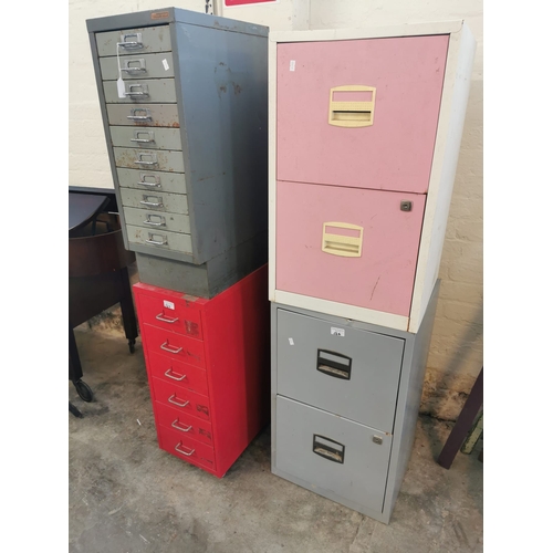 Two banks of steel filing drawers, together with two metal filing ...