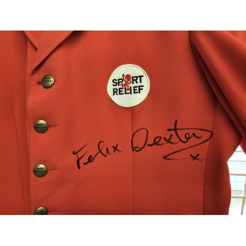 Sport Relief red jacket, signed in black pen by Felix Dexter, the brass ...