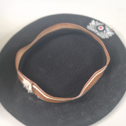 Two German Third Reich-style caps, comprising a Panzer officer’s M38 ...