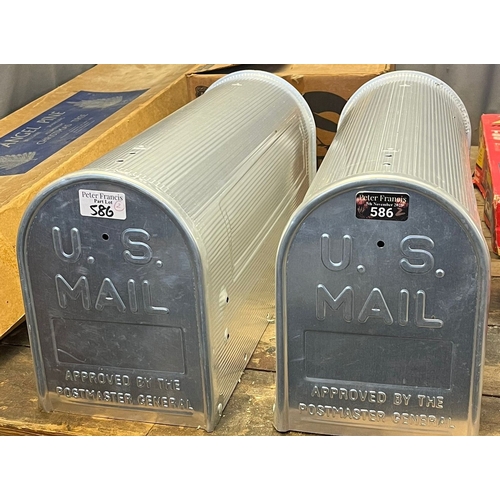 Two aluminium U.S. mailboxes, marked 'approved by the Postmaster ...