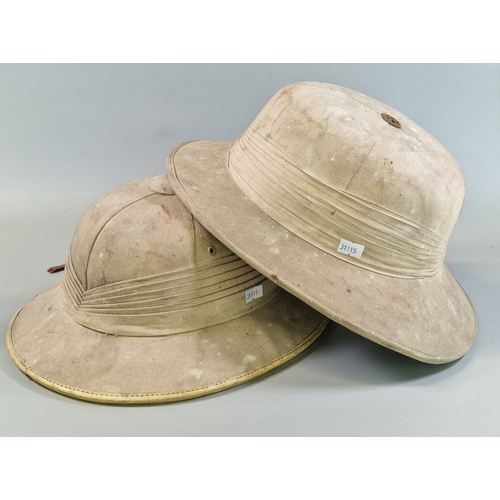 Two similar pith helmets, one marked to the inside Tejano Superb ...