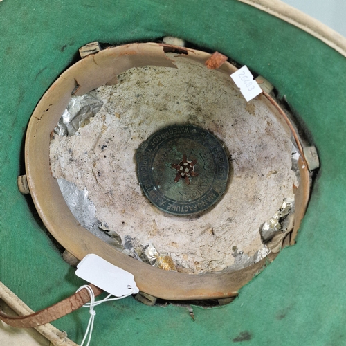 Two similar pith helmets, one marked to the inside Tejano Superb ...