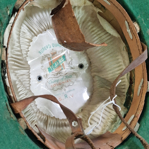 Two similar pith helmets, one marked to the inside Tejano Superb ...
