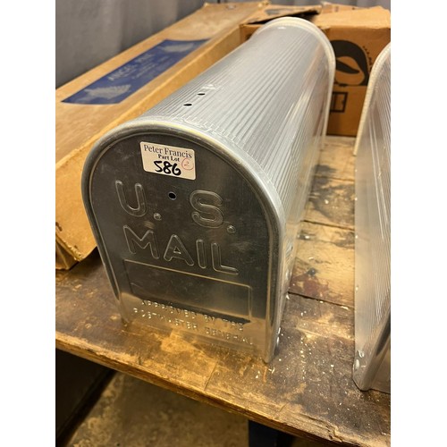 Two aluminium U.S. mailboxes, marked 'approved by the Postmaster ...