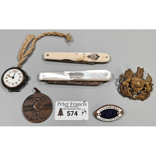 Small bag of oddments to include: two penknives, enamel RSPCA badge ...