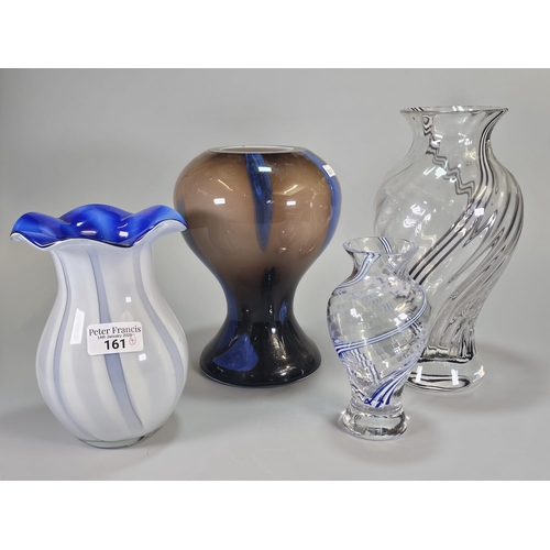 Two similar Caithness glass swirl design vases, together with two other ...