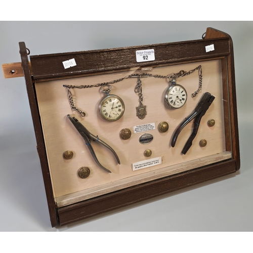 Cased montage of railway memorabilia to include: GWR badges, two open ...