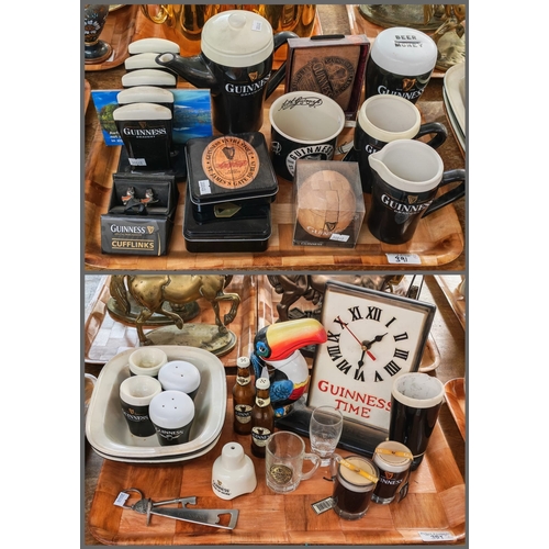 Two trays of assorted Guinness memorabilia to include: Guinness Time ...