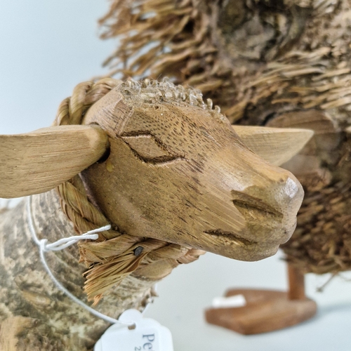 Two hand carved wooden animal sculptures, made from bamboo root to ...