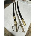 PAIR SHEATHED SWORDS