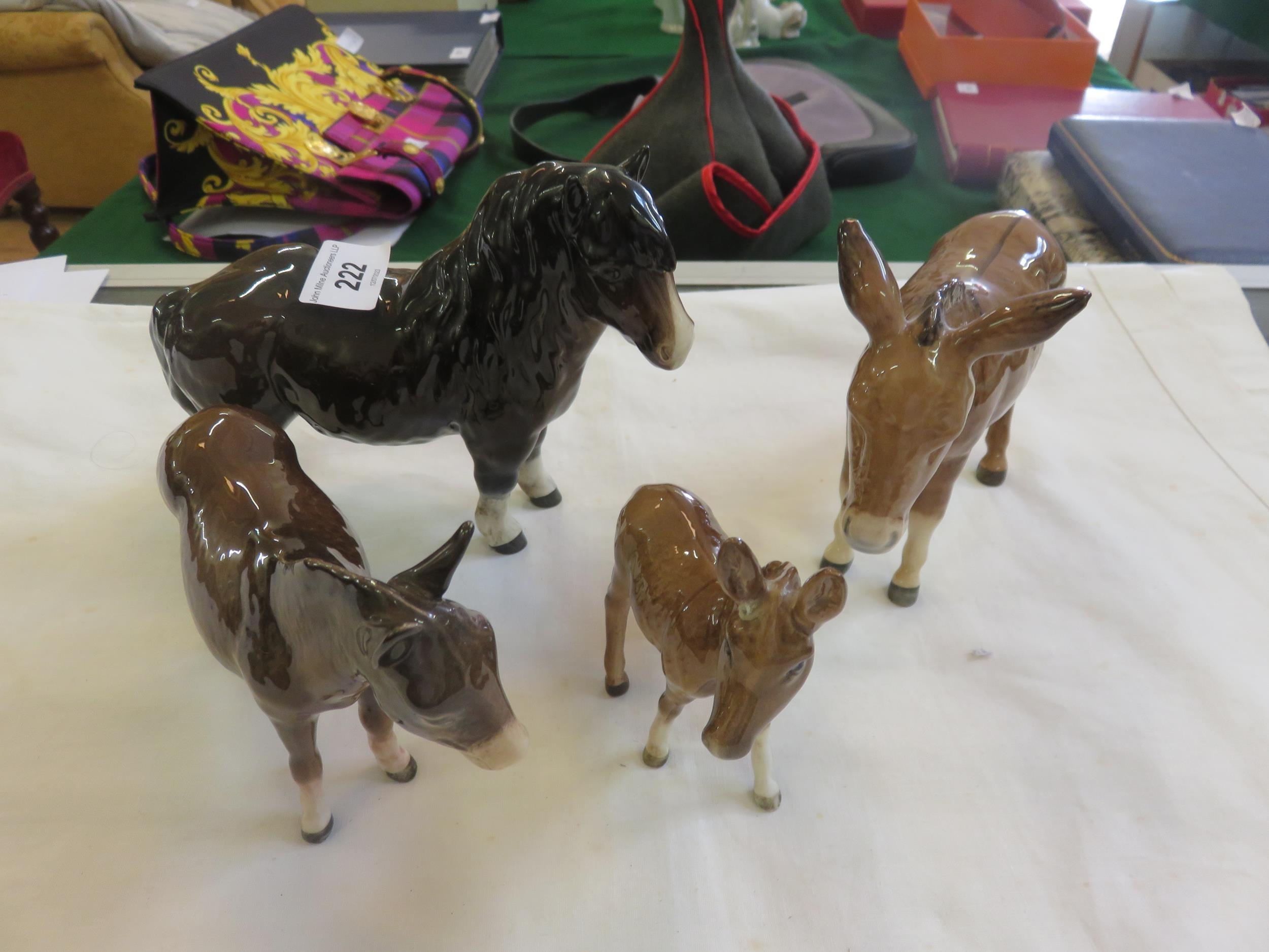 Four Beswick Donkey Figures