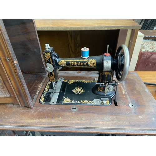 White sewing machine on a Singer table