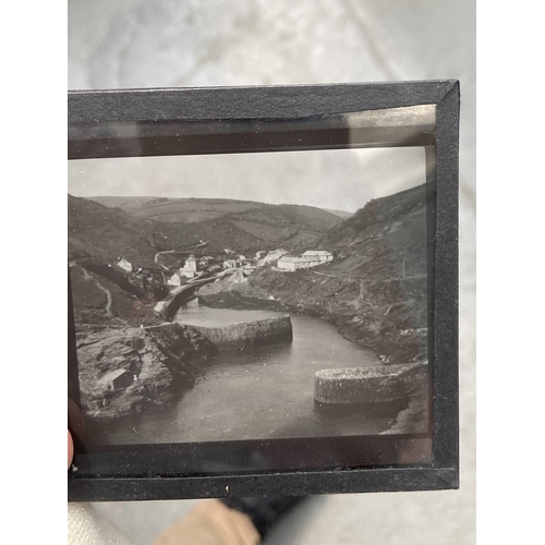 Box containing vintage glass lantern slides