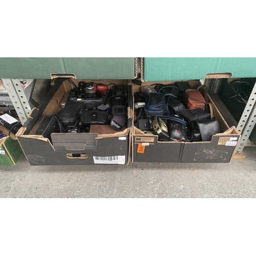 2 Boxes containing vintage cameras and accessories
