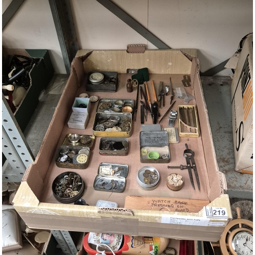Box containing assorted cogs, mechanical parts, compass' etc
