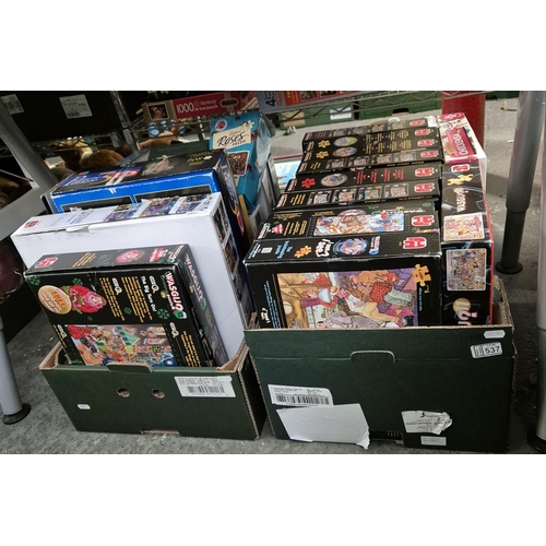 2 Boxes containing jigsaw puzzles