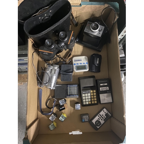 Box containing assorted electronics, including Roberts radio, Panasonic Digicam, Prinz binoculars