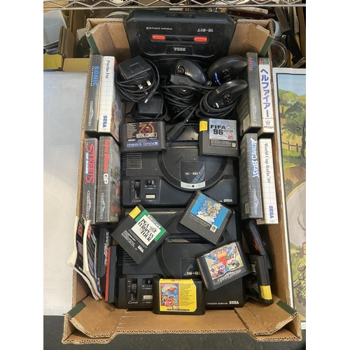 Box containing Sega Mega Drives and games