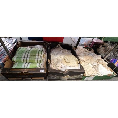 3 Boxes containing assorted table linen