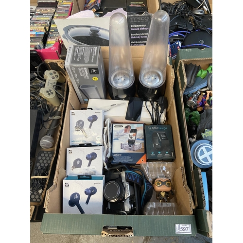 Box containing assorted electronics including wireless earbuds, and Bluetooth speakers etc