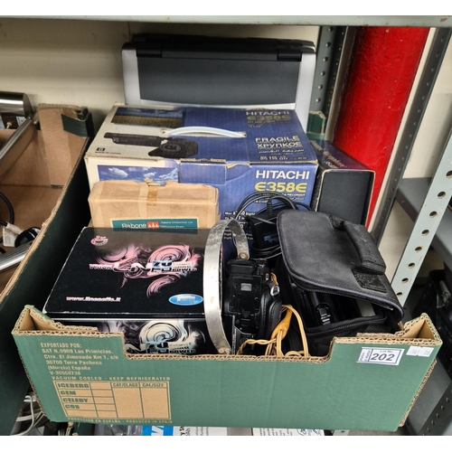 Box containing assorted electronics including dynamic microphone, video cameras etc