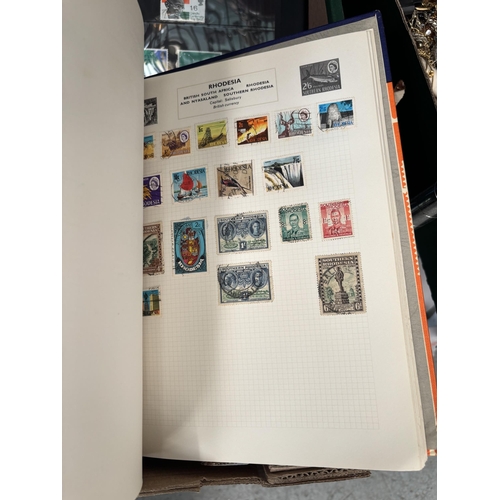 Box containing assorted stamp albums