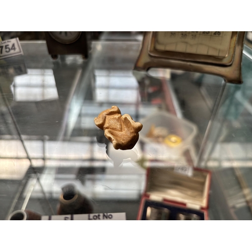 A decorated Netsuke frog