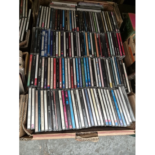 3 Boxes containing CDs, singles and cassettes
