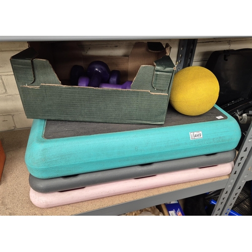 A step aerobics step and weights etc