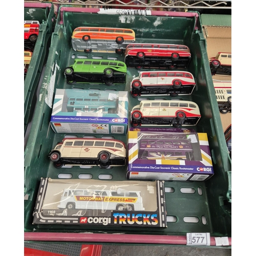 Box containing Corgi die cast coaches and buses