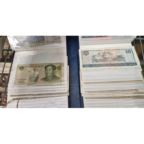 Album containing world bank notes