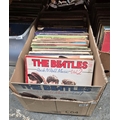 Box containing LPs including The Beatles and The Rolling Stones