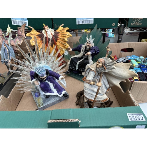 Box containing Enchantica figurines including 'Vrost' and 'Summer Wizard'